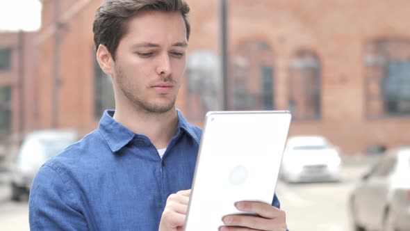Outdoor Portrait of Young Man Using Tablet, Stock Footage | VideoHive