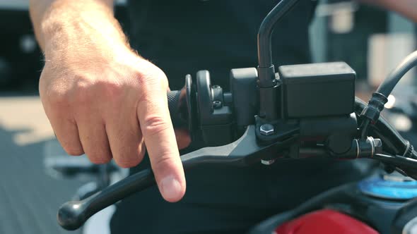 Male Hand on the Throttle of a Motorcycle Without a Glove, Stock Footage