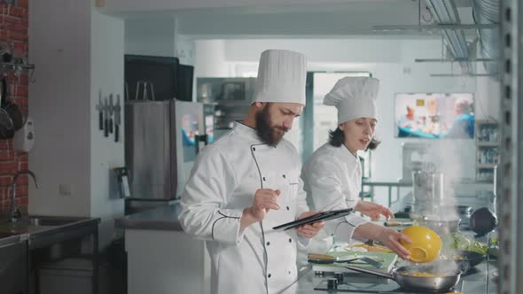 Male Chef Following Online Food Recipe on Touchscreen Tablet, Stock Footage