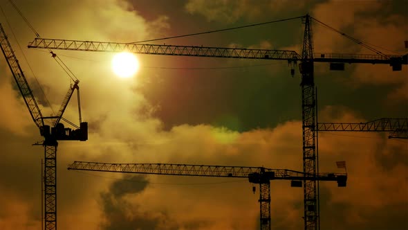 Time Lapse of Industrial Crane Construction Scenery At Sunset. Economy ...
