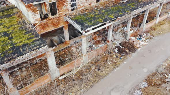 Ruined brick buildings with collapsed roofs. Aerial view., Stock Footage