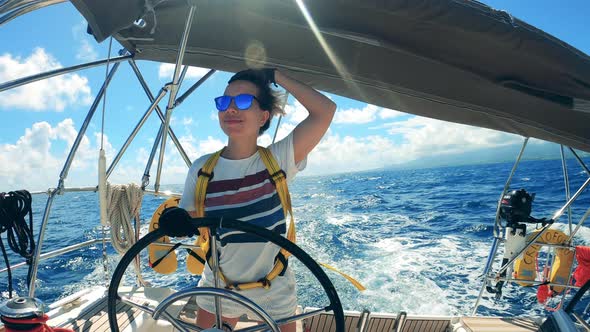 Front View of a Woman Dancing While Navigating a Boat. Young Female ...
