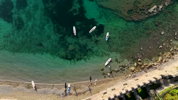 Sup surfing group aerial view 4 K Turkey Alanya, Stock Footage | VideoHive