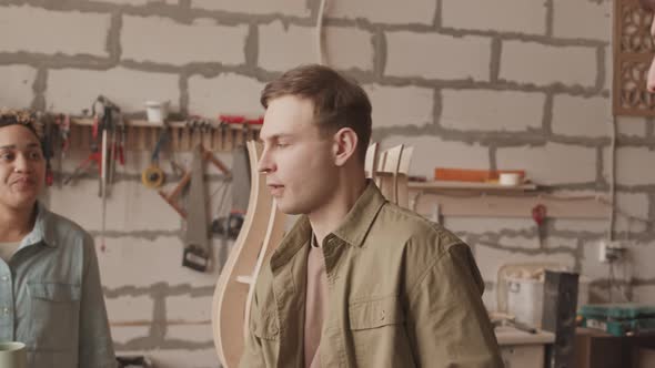 Team of Carpenters Talking during Lunch at Workplace, Stock Footage