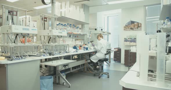 Scientist working in a pharmaceutical laboratory conducting experiments ...