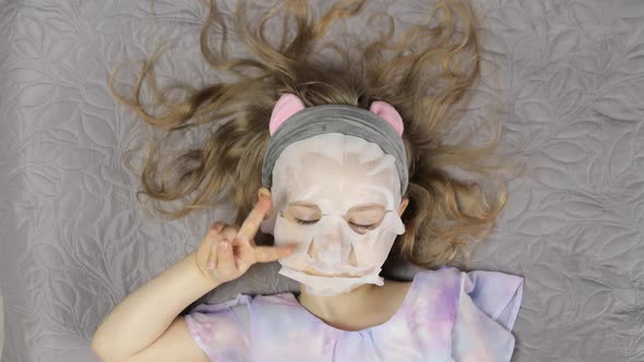 Teen Girl Applying Moisturizing Face Mask. Child Kid Take Care of Skin ...