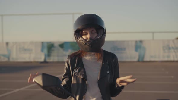 Beautiful Young Redhaired Woman Motorcyclist Dancing on Her Custom Bike ...
