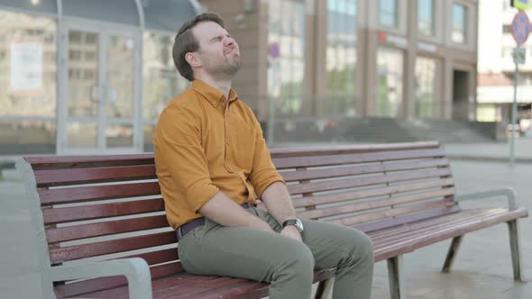 Tense Young Man Feeling Frustrated while Sitting Outdoor on Bench ...