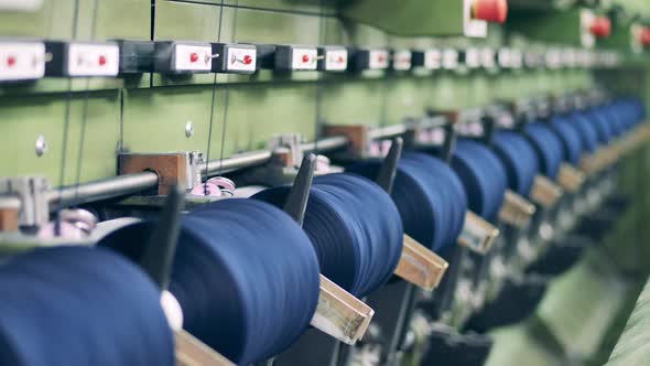 Sewing Spools are Rotating in the Industrial Machine, Stock Footage
