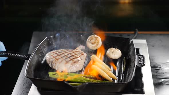 Professional Chef Cooking Flambe Style Dish on Restaurant Kitchen ...