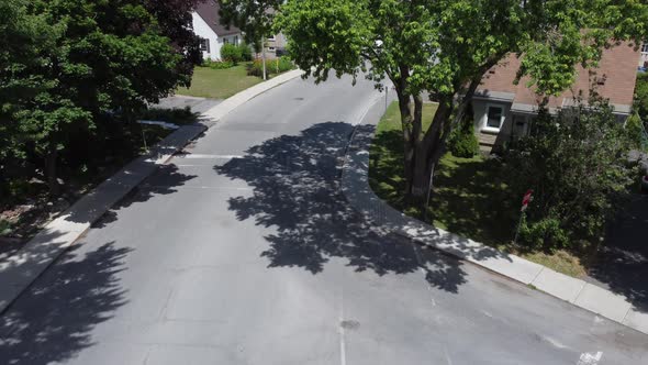 Stop sign at a residential intersection aerial, Stock Footage | VideoHive