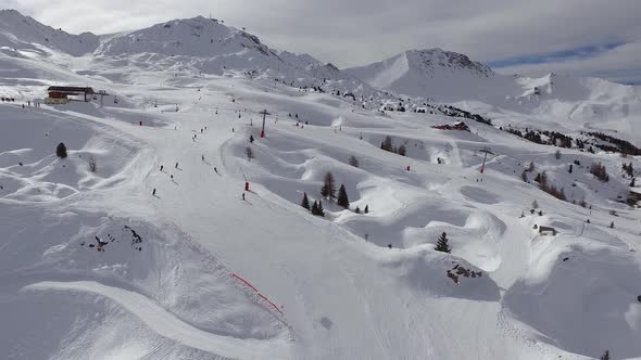 Aerial view of people skiing at a ski resort, Stock Footage | VideoHive