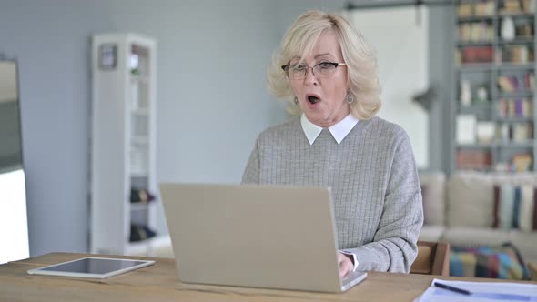 Sad Old Woman Facing Loss on Laptop in Modern Office, Stock Footage