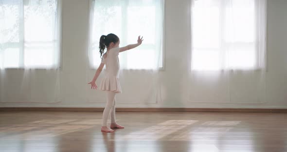 Little girl dancing alone in a studio, Stock Footage | VideoHive