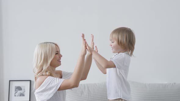 Happy Mother and Son Frolic in the Morning, Stock Footage | VideoHive