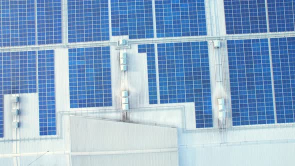 Aerial cinematic view of a solar panel on mall roof top, Stock Footage