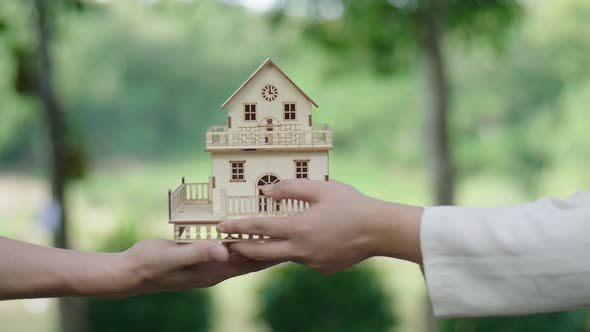 Hands Giving House Model To Other Hands, Stock Footage | VideoHive