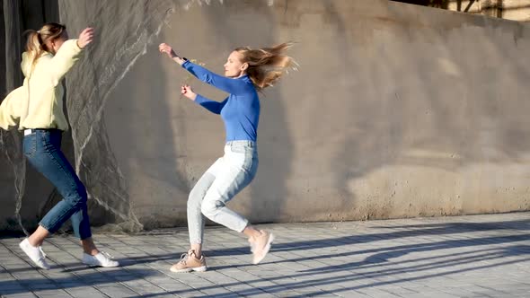 Two Girls Meeting After Long Time War Running Into Each Other with Open ...