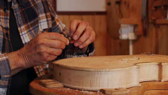 Female luthier at work in her workshop, Stock Footage | VideoHive