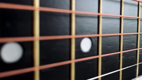 Zoom in Shot of Black Frets Fretboard Acoustic Guitar String, Stock Footage