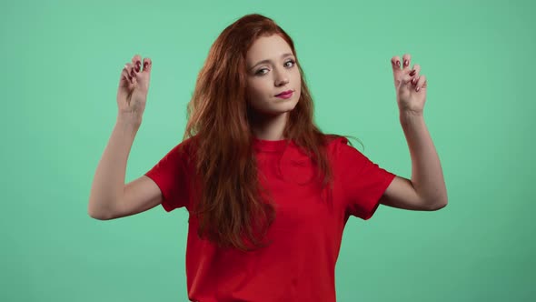 Pretty Woman with Red Hair Showing with Hands and Two Fingers Air ...
