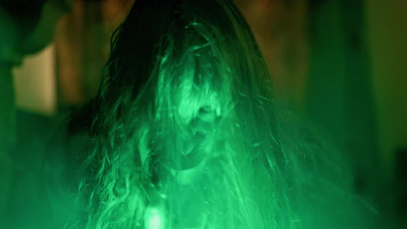 Scary ghost woman screaming through dirty glass on dark background ...