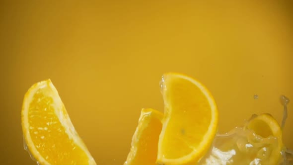 Closeup of Fresh Oranges Bouncing with the Splashes of the Orange Juice ...