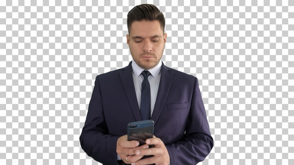 Serious businessman texting message on his phone, Alpha Channel, Stock ...