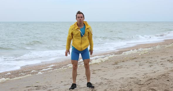Young Man Doing Squats Exercise at Ocean Beach, Stock Footage | VideoHive
