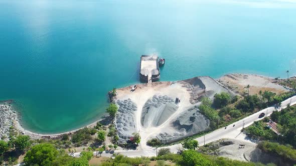 Aerial view of Extracting and transportation of rocks in a shale quarry ...