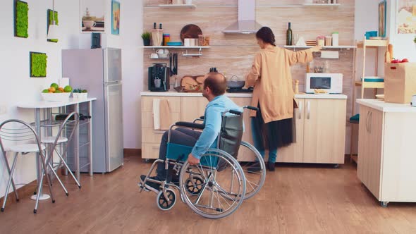 Disabled Man in Wheelchair Opens Refrigerator, Stock Footage | VideoHive