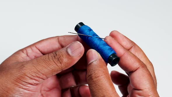 Fingers Hold Blue Thread And Needle, Stock Footage | VideoHive