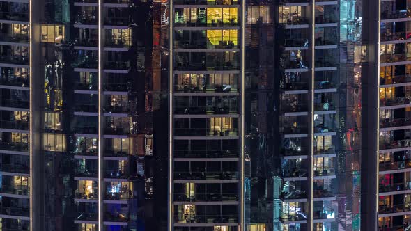 Windows in Apartments of a High Class Building at Night Timelapse ...