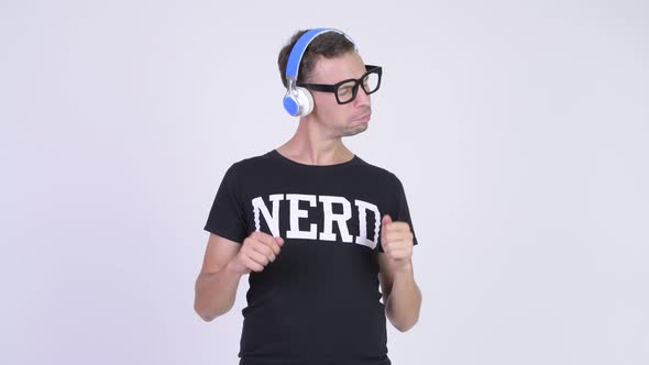 Studio Shot of Nerd Man Singing and Listening To Music, Stock Footage