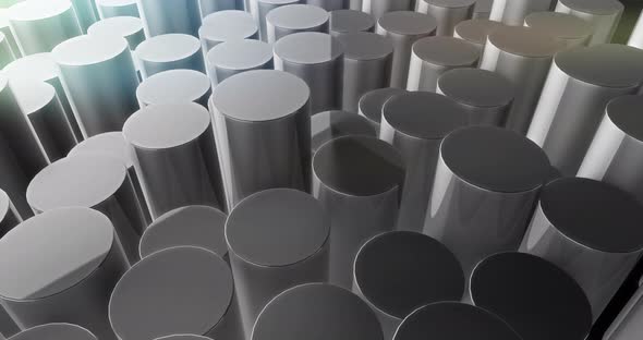 Abstract background of round metallic shiny cylinders moving up and ...
