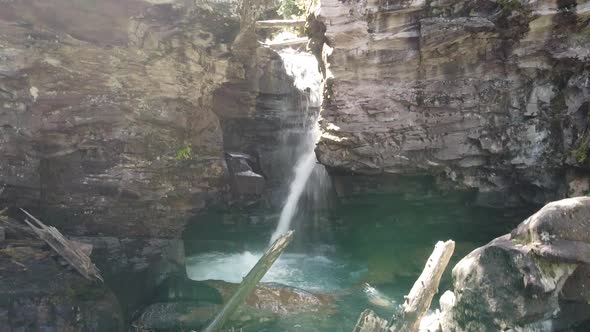 Aerial From Low to High of Amazing Hidden Waterfall Carving Through ...