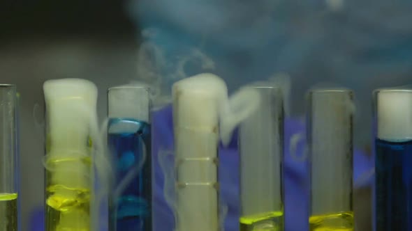 Lab Worker Dripping Liquid Into Boiling Test Tubes, Chemical Reaction ...