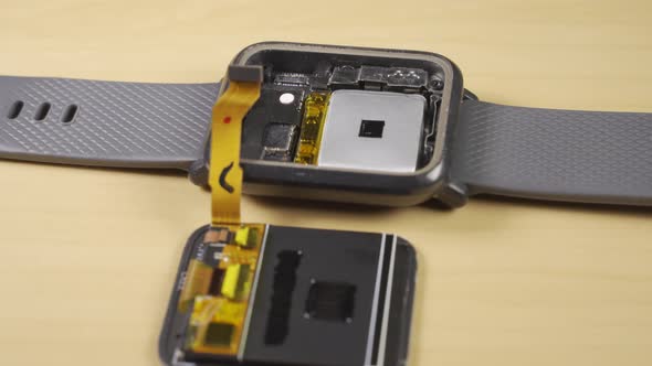 Disassembled Smartwatch Showing the Interior Battery Different Sensors ...
