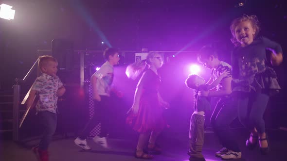 Young Children Dancing Happily at a Disco Party with Bright Lights ...