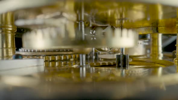 Inside View of Moving Clockwork of Golden Mechanical Clock, Stock Footage