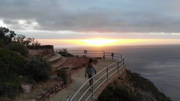 Man Walking into Sunset in Chapman's Peak, Cape Town, Stock Footage