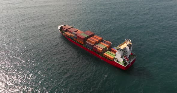 Container ship loaded with Shipping containers holding position at sea ...