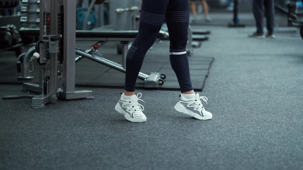 Feet of sporty woman shifting from toes to heels in gym, Stock Footage