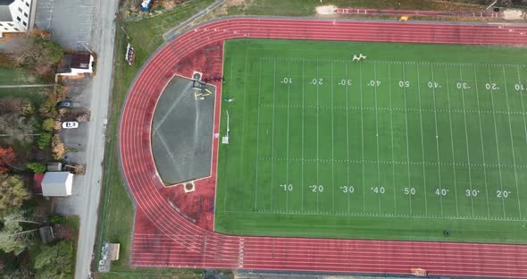 Top down truck shot of football field. Athletic stadium track and field ...