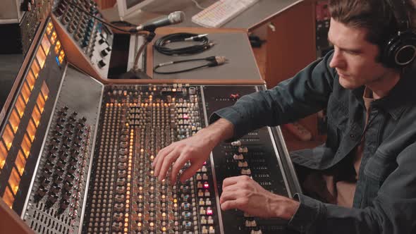 Music Producer Using Mixing Console at Record Studio, Stock Footage