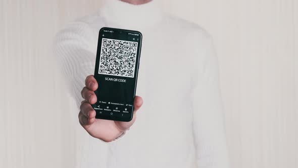 Male Hand Shows QR Code on Smartphone on White Background, Stock Footage