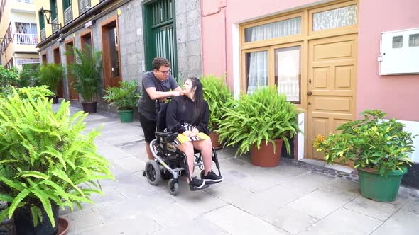 Young Disabled Woman in Wheelchair Dating with Her Boyfriend Outdoors ...