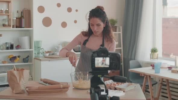 Female Influencer Adding Flour to Dough, Stock Footage | VideoHive