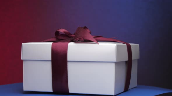 White Present Carton Box with Purple Ribbon and Bow, Stock Footage