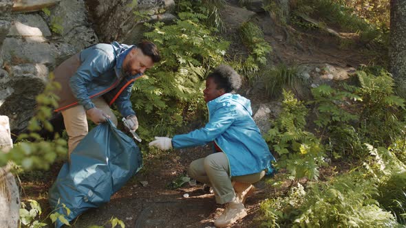 Tourists Cleaning Up Trash on Campground, Stock Footage | VideoHive